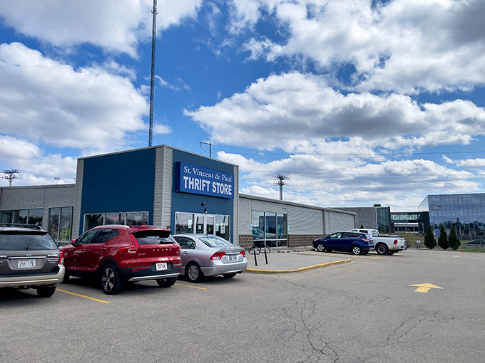 The distinctive blue facade of St. Vincent de Paul stands like a beacon for bargain hunters on Odana Road, promising treasures within. 