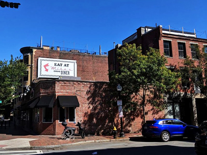 The brick fa&ccedil;ade of Mike's City Diner stands like a beacon of breakfast hope on Washington Street, promising culinary salvation to hungry Bostonians.