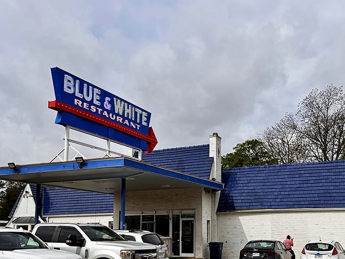The iconic Blue & White sign beckons hungry travelers like a neon lighthouse on Highway 61. This classic roadside architecture promises comfort food and Mississippi hospitality.