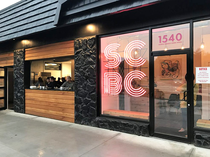 The neon glow of SCBC beckons breakfast enthusiasts like a pink lighthouse guiding hungry sailors to shore. Modern meets cozy in this distinctive Omaha storefront.