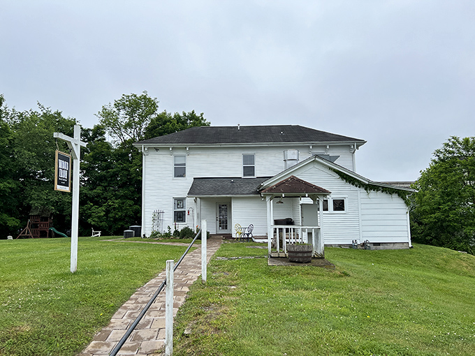The journey to breakfast bliss begins with this charming white farmhouse. A wooden walkway practically begs you to follow it toward culinary adventure.