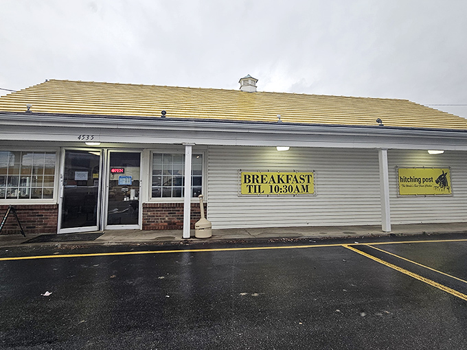 The unassuming exterior of culinary greatness. That yellow "BREAKFAST TIL 10:30AM" sign might as well read "Life-Changing Chicken Beyond This Point."