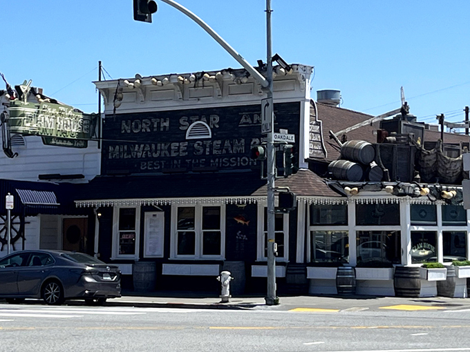 Twilight transforms this 1861 seafood sanctuary into a maritime mirage. The vintage neon sign beckons hungry travelers like a lighthouse for the famished.