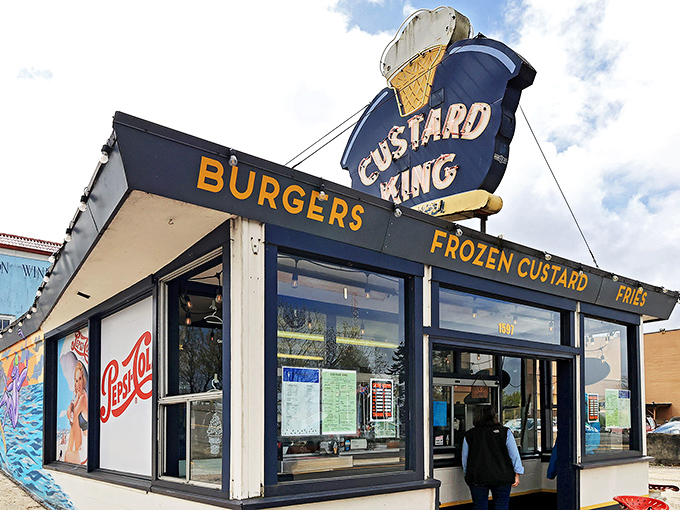 The royal blue trim and vintage sign of Custard King stand proudly against Astoria's sky, like a delicious mirage beckoning custard pilgrims.