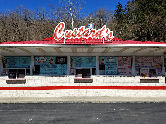 The neon glow of Custard's against a twilight sky isn't just signage&mdash;it's a beacon of hope for dessert lovers seeking frozen nirvana.
