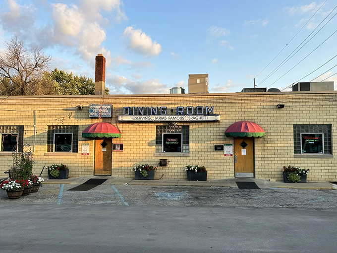 The vintage "TAVERN" sign beckons pasta pilgrims to this unassuming yellow-brick building that's been feeding Indianapolis longer than most of us have been hungry.