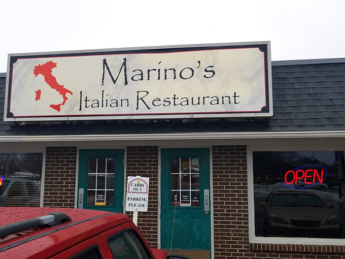 The unassuming exterior of Marino's, with its turquoise door and boot-shaped Italian sign, proves that culinary treasures often hide in the most modest packages. 