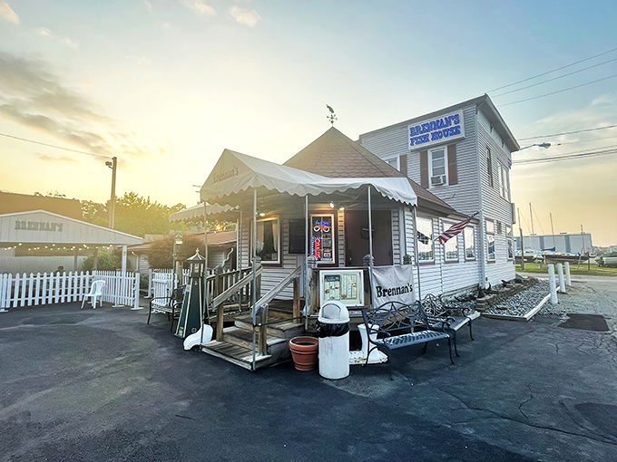 The unassuming white clapboard exterior of Brennan's Fish House stands like a maritime mirage in landlocked Ohio, complete with that charming red-roofed turret.