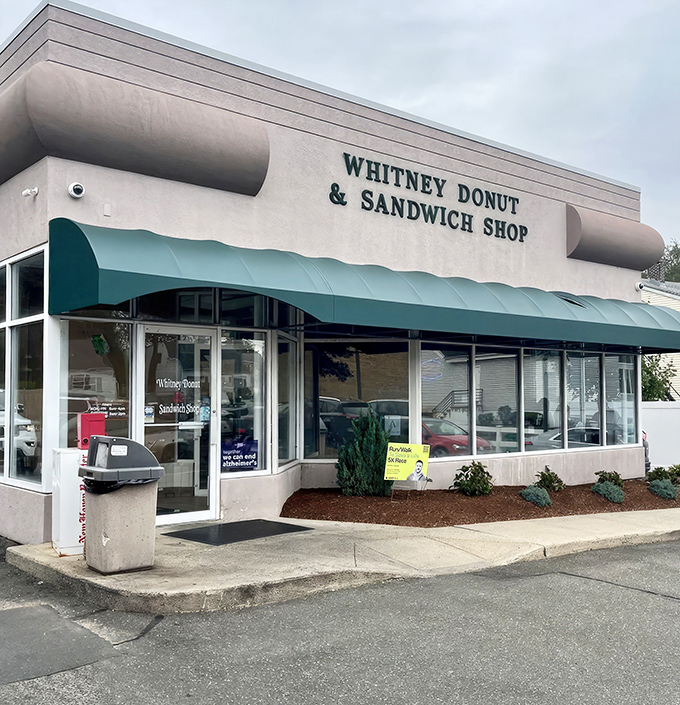 The unassuming exterior of Whitney Donut & Sandwich Shop proves once again that culinary treasures often hide in plain sight. 