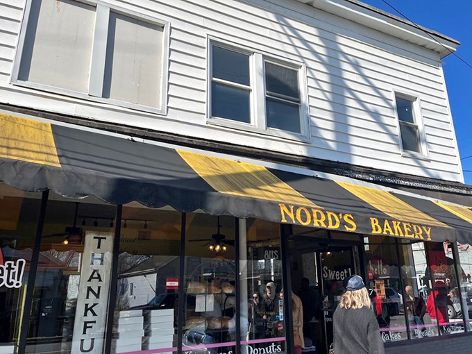 The storefront with its black and yellow awning promises sweet salvation. Nord's Bakery stands as Louisville's temple of temptation, where calories don't count and joy is guaranteed.