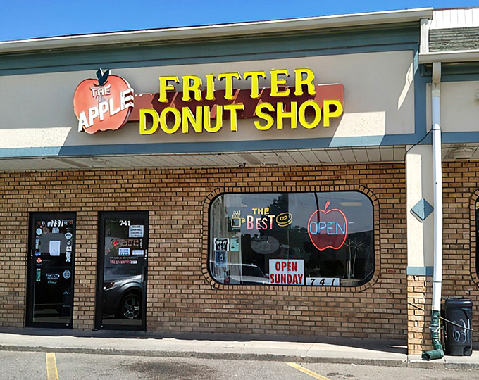 The yellow block letters against brick might not scream "culinary destination," but locals know this humble storefront houses donut royalty.