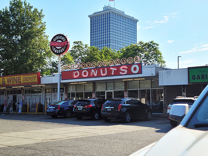 The iconic Gibson's sign stands like a beacon for donut lovers, promising sweet salvation beneath those bold red letters stretching across the Memphis skyline. 