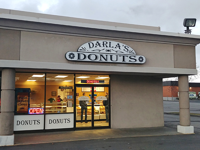 The unassuming storefront of Darla's Donuts stands like a beacon of hope for the sugar-deprived. No fancy frills, just the promise of donut perfection within.