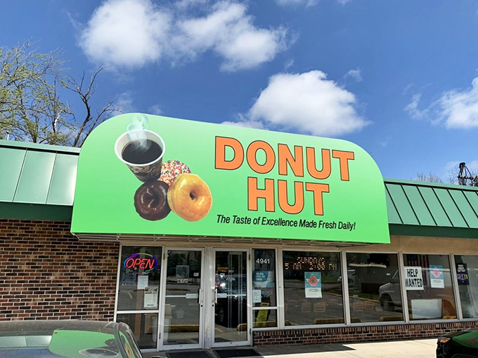 The green awning beckons like a sugar-coated lighthouse in a sea of ordinary breakfasts. Des Moines' morning pilgrimage spot doesn't need fancy signage when the donuts speak volumes.