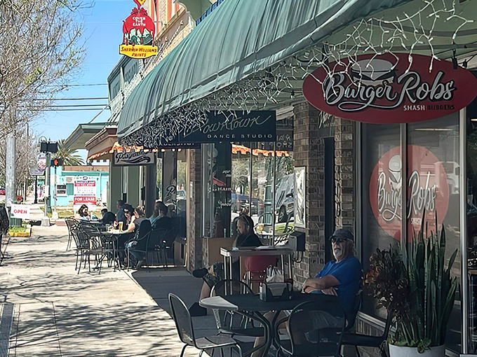 The unassuming storefront of BurgerRobs in Titusville beckons with its red signage and outdoor seating&mdash;a burger sanctuary hiding in plain sight.
