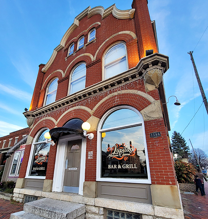 Lupita's historic brick building glows at twilight, like a beacon calling hungry souls home. Those string lights aren't just decoration&mdash;they're a dinner invitation you can't refuse.