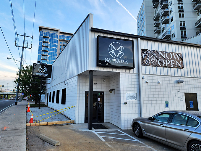 The unassuming white exterior of Marble Fox Brewing Company stands like a blank canvas, hiding the flavor explosion waiting inside. Nashville's best-kept liquid secret.