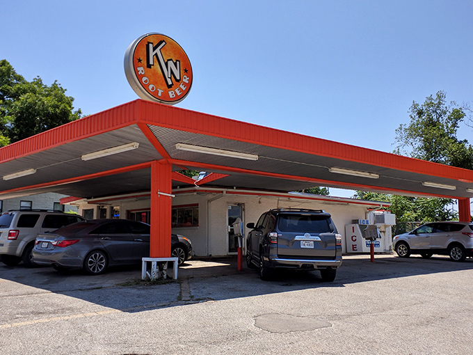 The unassuming exterior of K N Root Beer Drive In proves once again that Texas's greatest culinary treasures often hide in plain sight.