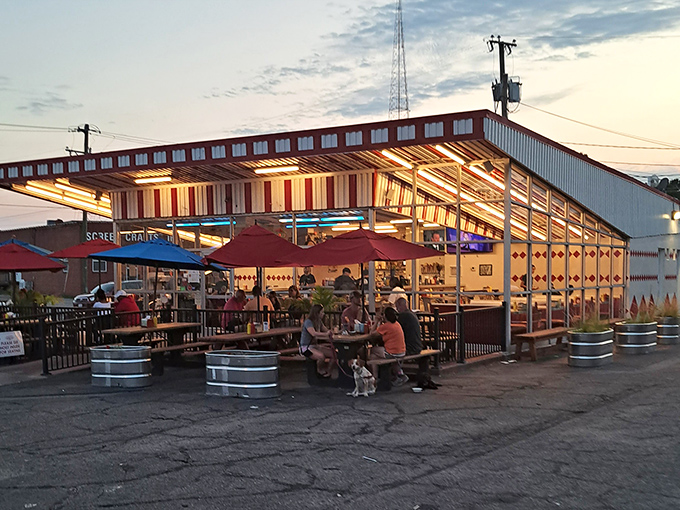 The retro-futuristic design of Boulevard Burger & Brew beckons like a time machine disguised as a diner. Those colorful umbrellas aren't just for show&mdash;they're happiness markers.