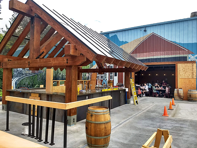 The timber-framed outdoor seating area beckons like an old friend, promising cold brews and mountain views that'll make your city stress evaporate instantly.
