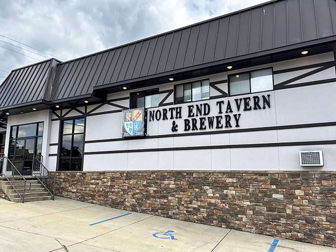 The Tudor-style exterior of North End Tavern & Brewery stands as a welcoming beacon for hungry travelers and thirsty locals alike.