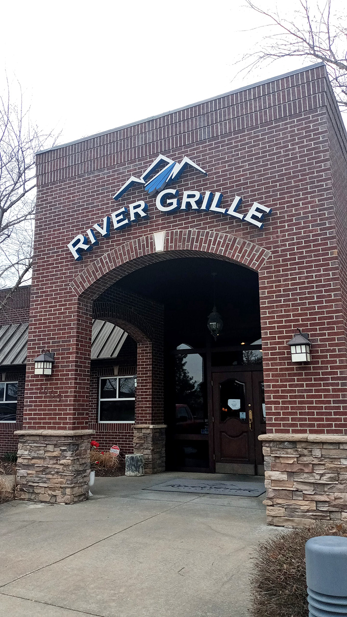 The brick fa&ccedil;ade of River Grille stands like a culinary fortress, promising treasures within that make the journey to Bentonville worthwhile.
