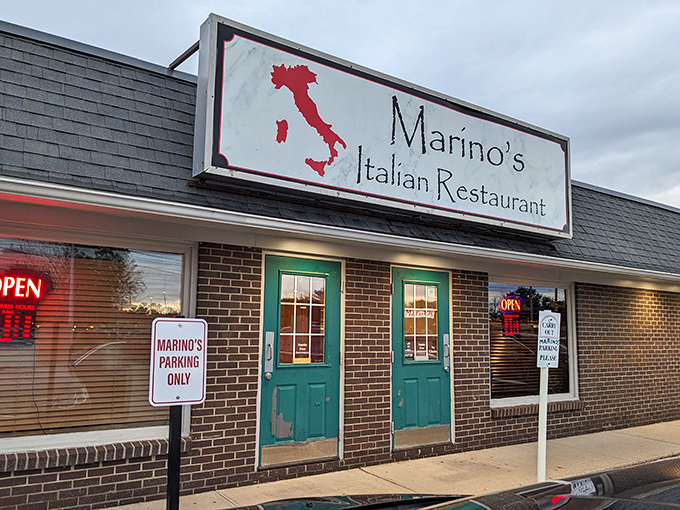 The unassuming exterior of Marino's, with its turquoise door and boot-shaped Italian sign, proves that culinary treasures often hide in the most modest packages.