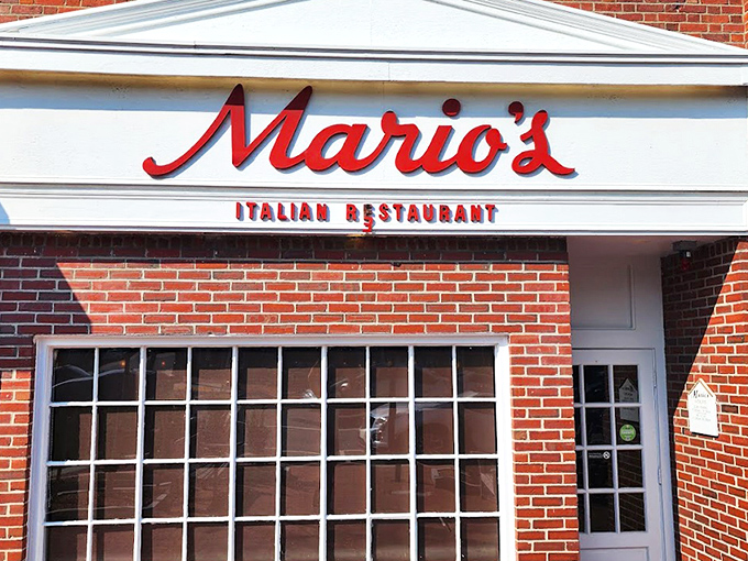 The iconic red script of Mario's against classic brick &ndash; like a neon welcome sign for your stomach that's been guiding hungry Lexingtonians for generations.