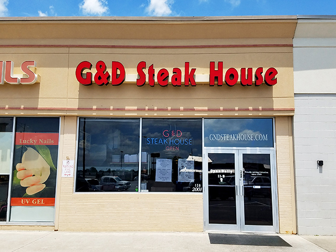 The red letters of G & D Steakhouse beckon like a beacon for beef lovers. No fancy frills, just the promise of serious steak satisfaction inside.