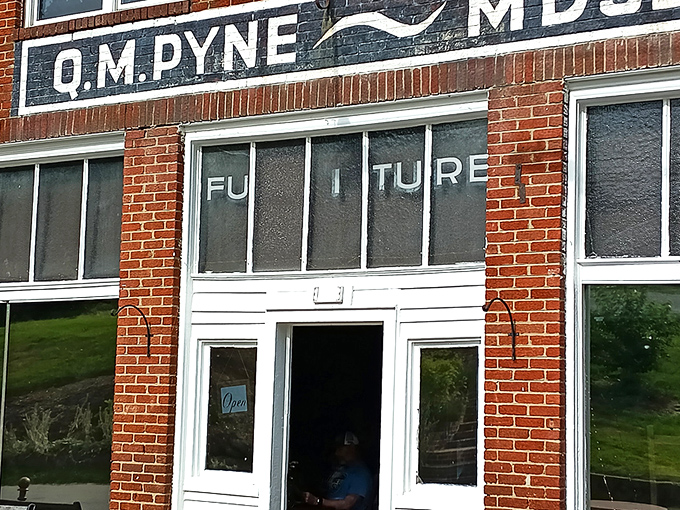 The historic O.M. Pyne building stands as a culinary time machine in tiny Eggleston. Red brick, weathered benches, and small-town charm set the stage for an extraordinary meal.