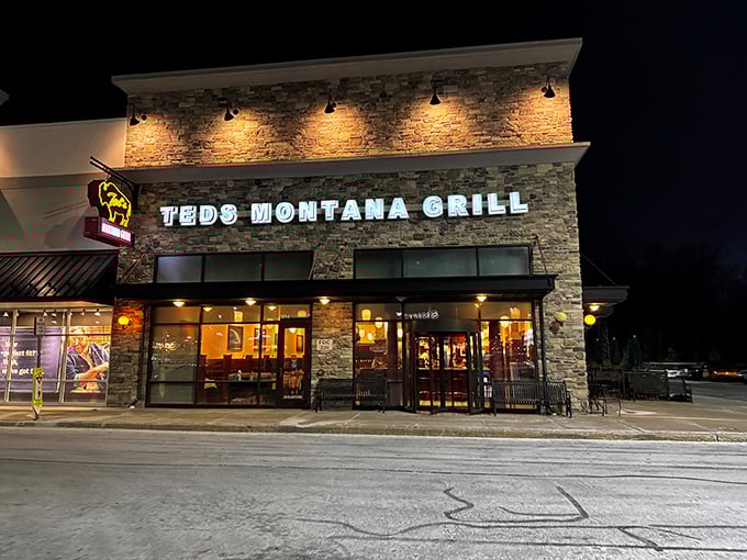 Ted's Montana Grill stands like a Western outpost in Newark, its stone facade and warm glow promising carnivorous delights within. The bison logo isn't just decoration&mdash;it's a promise.