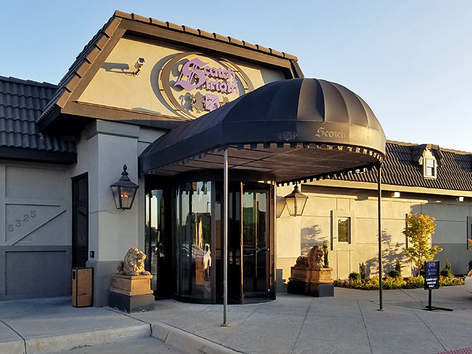 The iconic entrance to Scotch & Sirloin, where those stone lions aren't just guarding the door&mdash;they're keeping the vegetarians at bay.