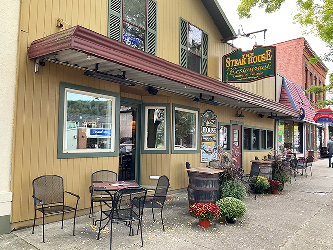 The unassuming yellow exterior hides culinary treasures within, like finding Batman's cave disguised as a suburban home in Wellsboro. 