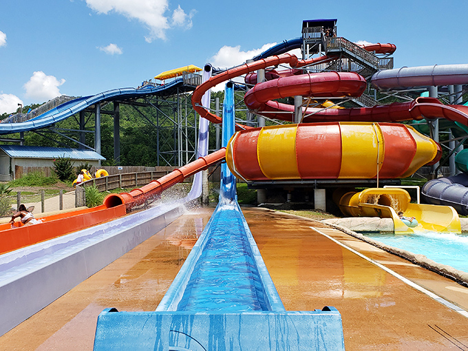 A kaleidoscope of water slides twists against the Arkansas sky, promising the perfect remedy for those "is this actually the surface of the sun?" summer days.