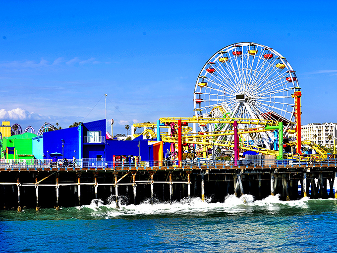 The ultimate California dream: a vibrant amusement park perched over the Pacific Ocean, where cotton candy dreams and salty breezes create perfect seaside memories.