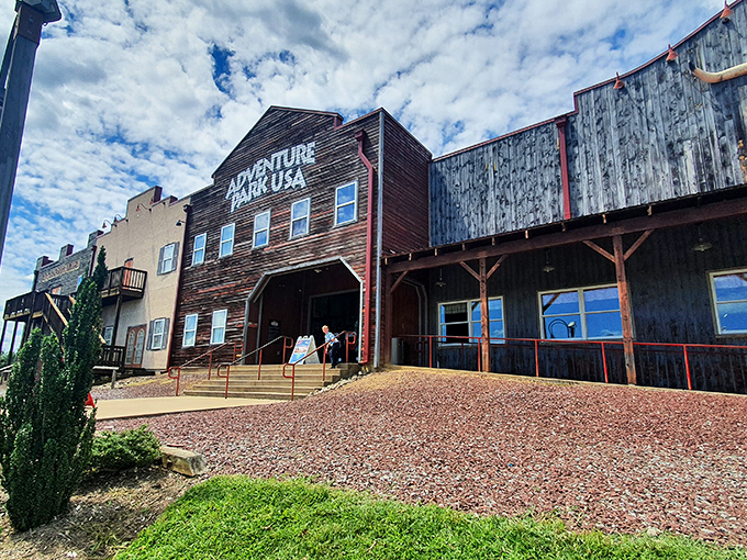 The Western-themed fa&ccedil;ade of Adventure Park USA welcomes visitors with rustic charm and the promise of old-school fun waiting just beyond those wooden doors.