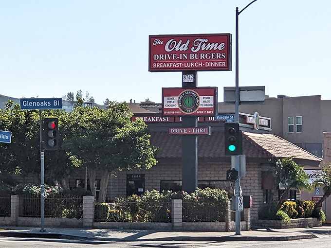 The red-tiled roof and brick facade of Old Time Drive In stands as a beacon of comfort food in Sun Valley, where California sunshine meets classic American dining.