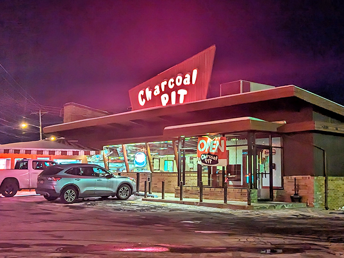 The iconic A-frame roof of Charcoal Pit stands like a mid-century beacon on Concord Pike, promising burger bliss to all who enter.
