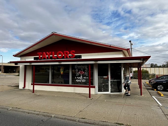 The classic red and white exterior of Taylor's Maid-Rite stands as a beacon of culinary tradition in downtown Marshalltown, promising loose-meat perfection within.