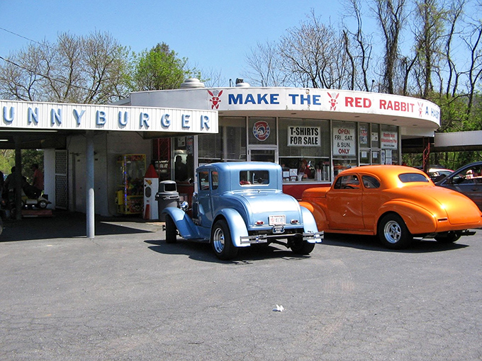 The iconic "Make The Red Rabbit A Habit" sign welcomes hungry travelers like a beacon of burger salvation on Route 322. Nostalgia never tasted so good. 