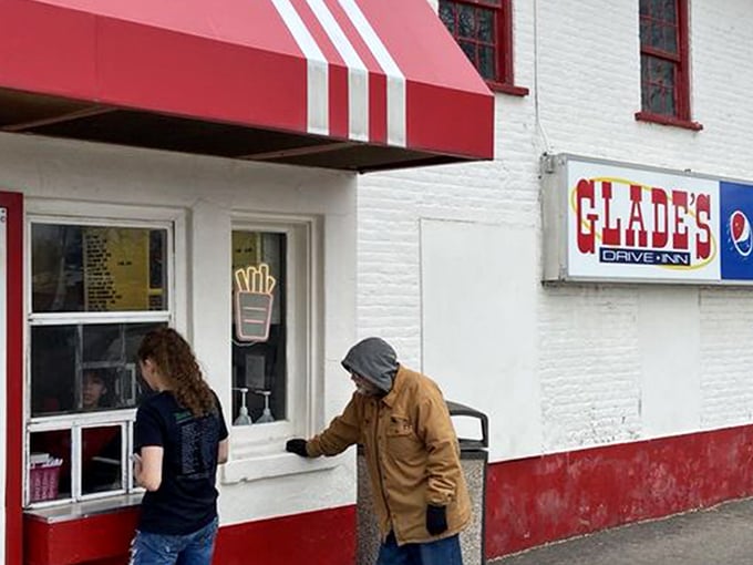 The classic red and white exterior of Glade's stands like a time capsule on Spanish Fork's corner, beckoning hungry travelers with nostalgic charm.