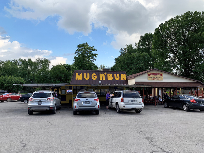 The bright yellow "MUG n BUN" sign stands as a beacon of hope for burger lovers who know that sometimes the best meals come from the most unassuming places.