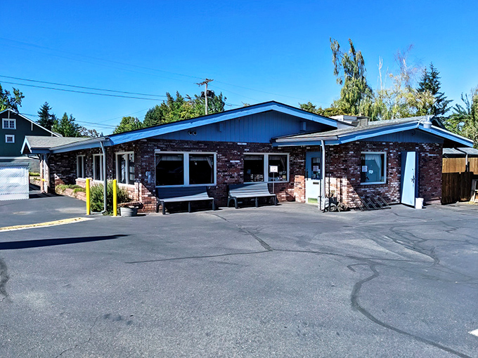 The unassuming brick exterior of Sybil's belies the breakfast magic happening inside. Blue trim and waiting benches hint at the diner's popularity.