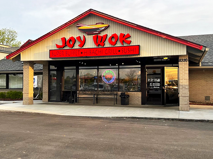 A beacon of culinary promise in strip mall form, Joy Wok's blazing red signage announces itself with all the subtlety of your hungry stomach at 3 PM.