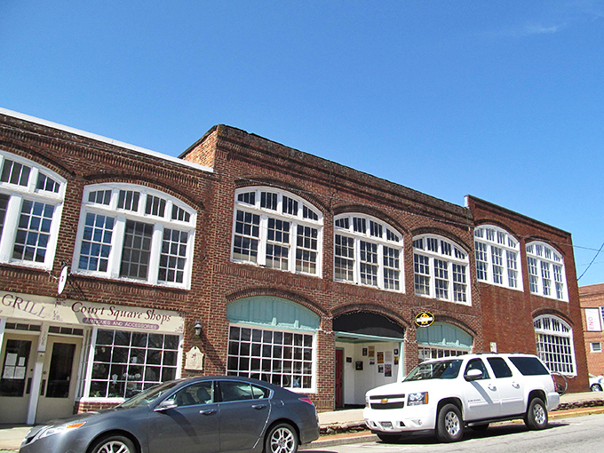 Historic brick buildings line Hillsborough's downtown, where arched windows and classic storefronts create a timeless shopping backdrop that practically begs for exploration.