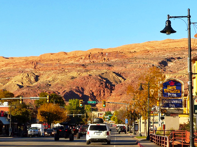 Main Street Moab, where pickup trucks are the fashion statement and those red rock backdrops aren't painted&mdash;Mother Nature just showing off.