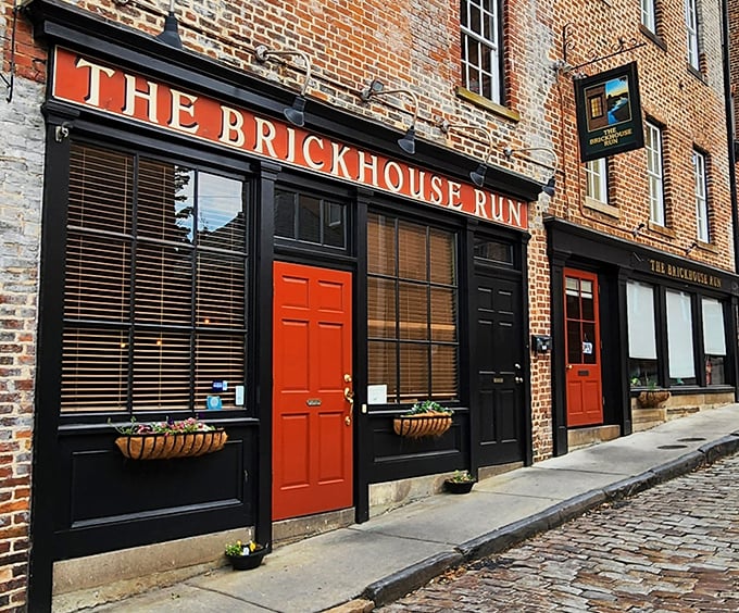 The historic brick fa&ccedil;ade and vibrant red door of The Brickhouse Run stand as Petersburg's culinary time portal. Those cobblestones have stories to tell!