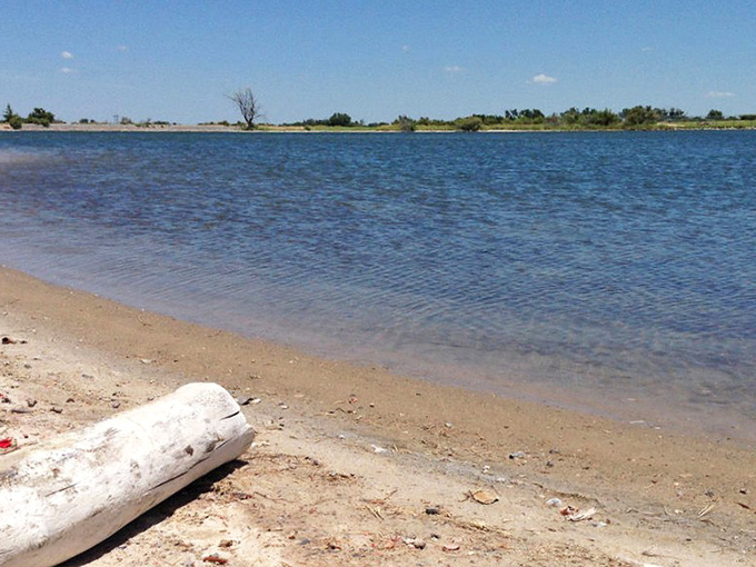 Crystal clear waters stretch to the horizon, proving that sometimes the best beaches aren't anywhere near an ocean. Oklahoma's liquid surprise.