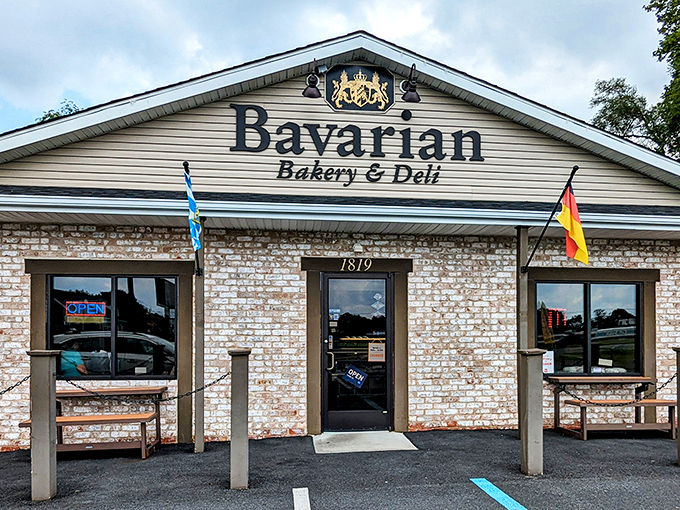 The Bavarian dream awaits! This charming stone-faced building with its distinctive flags and royal crest promises authentic German delights inside.