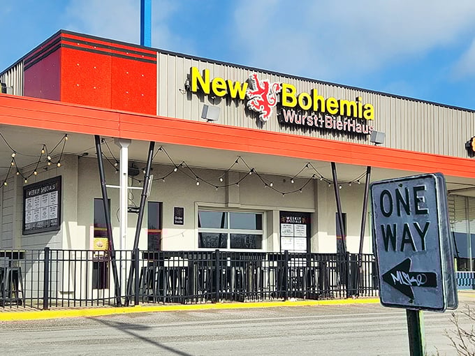 The golden lion on New Bohemia's sign stands guard like a medieval sentinel, promising Bavarian delights within those red-trimmed walls.